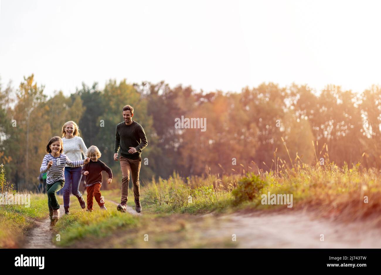 Young family having fun outdoors Stock Photo - Alamy