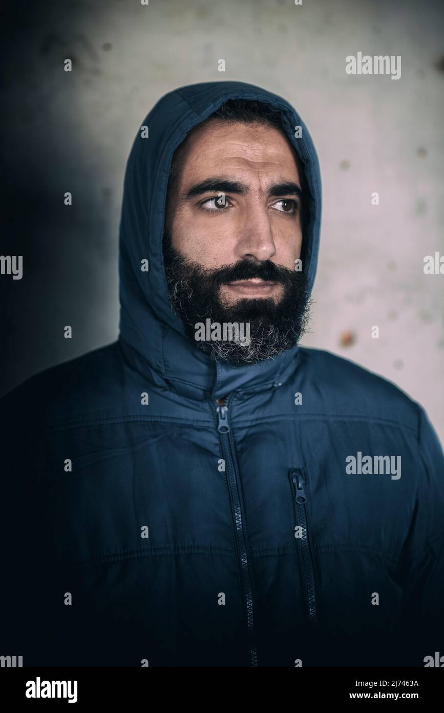 Bearded middle eastern man wearing hooded jacket Stock Photo - Alamy