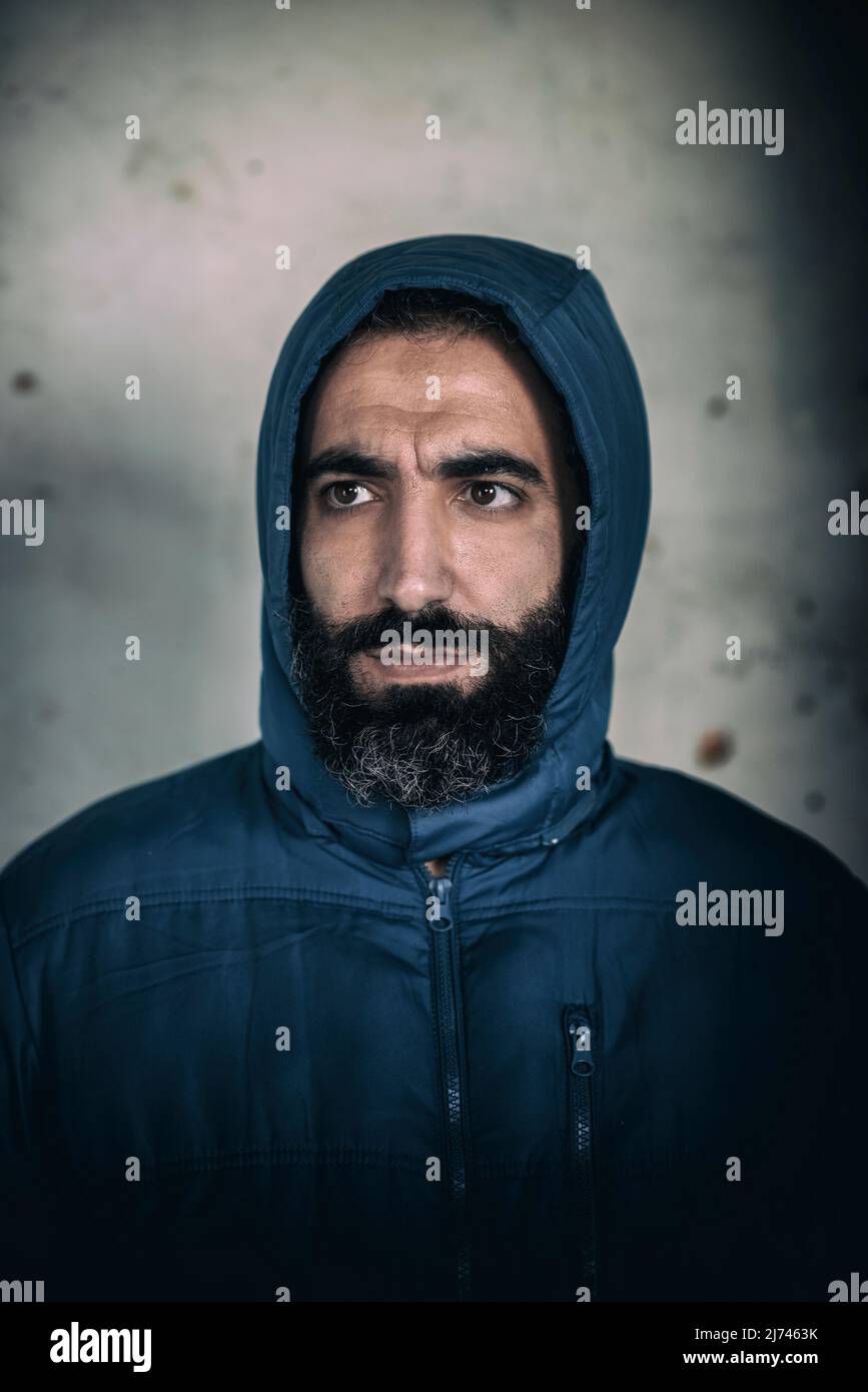 Bearded middle eastern man wearing hooded jacket Stock Photo - Alamy