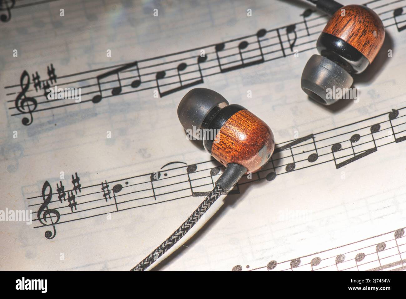 Detail of musical score with headphones Stock Photo - Alamy