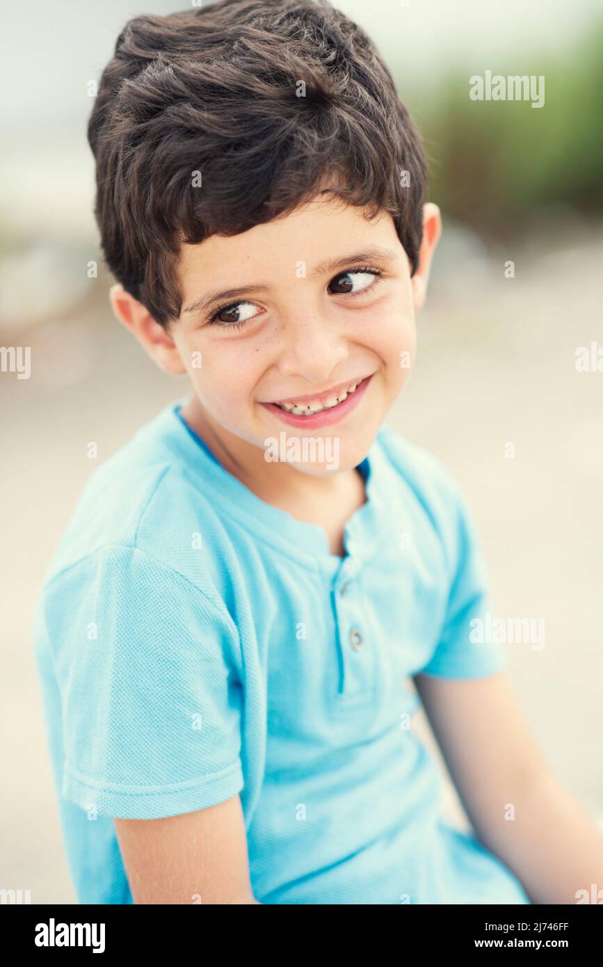 Happy boy smiling outdoors Stock Photo - Alamy