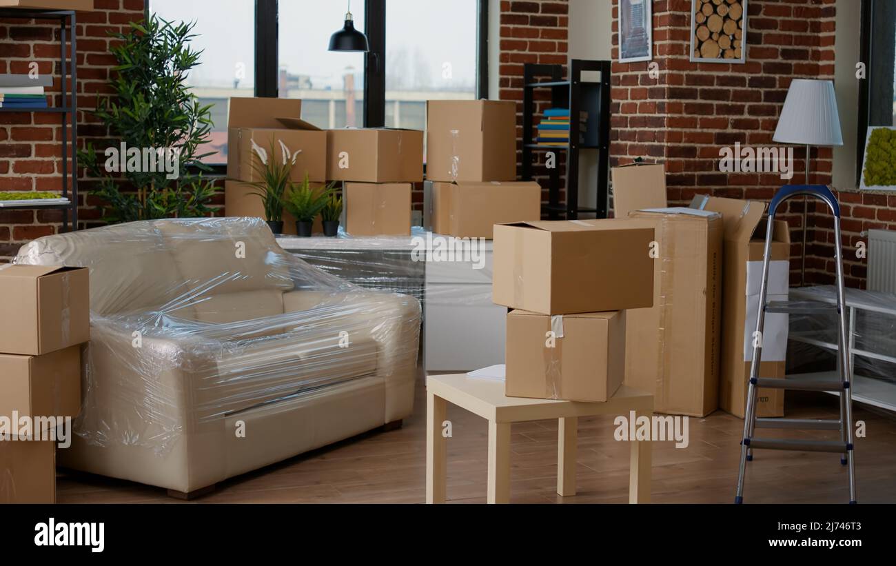 Empty apartment flat full of moving unpacked cardboard boxes, storage ...