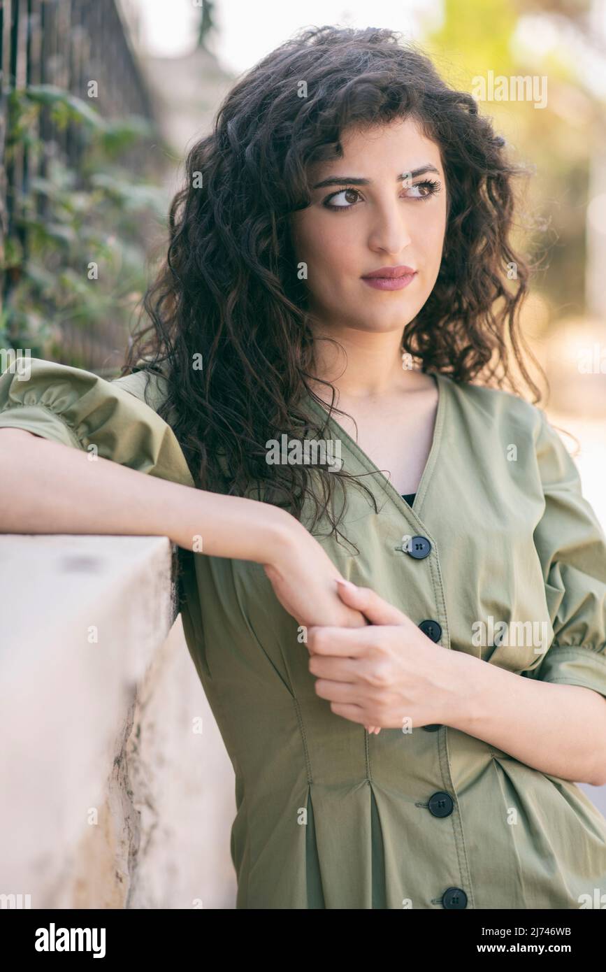 Sad woman standing outdoors Stock Photo - Alamy