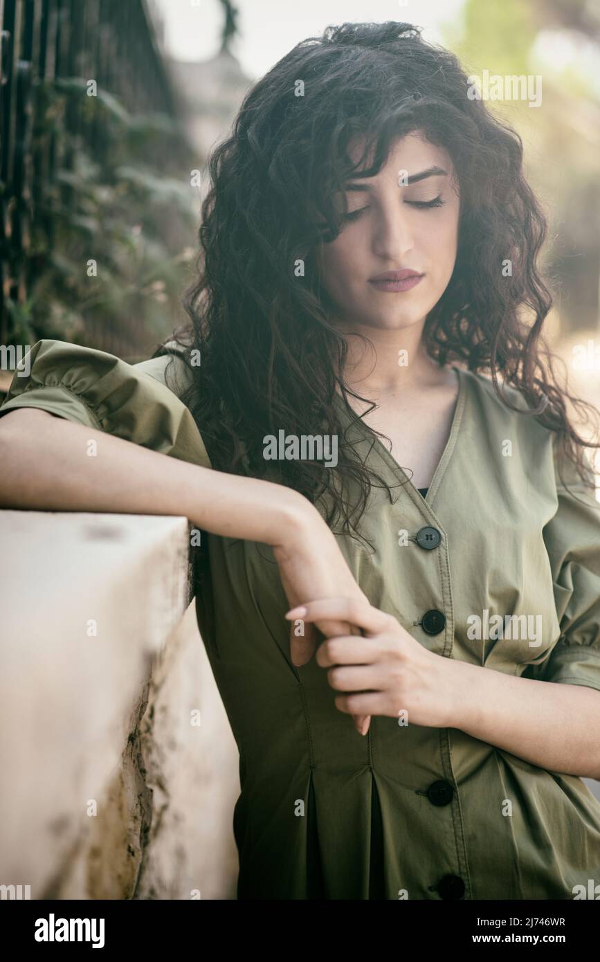 Sad woman standing outdoors Stock Photo - Alamy