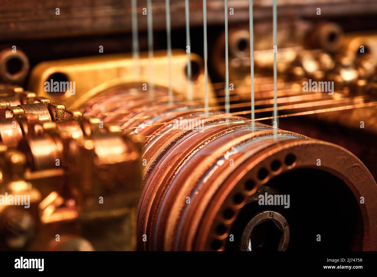 Coil winder machine with jackshafts copper wire drawing die Stock Photo ...