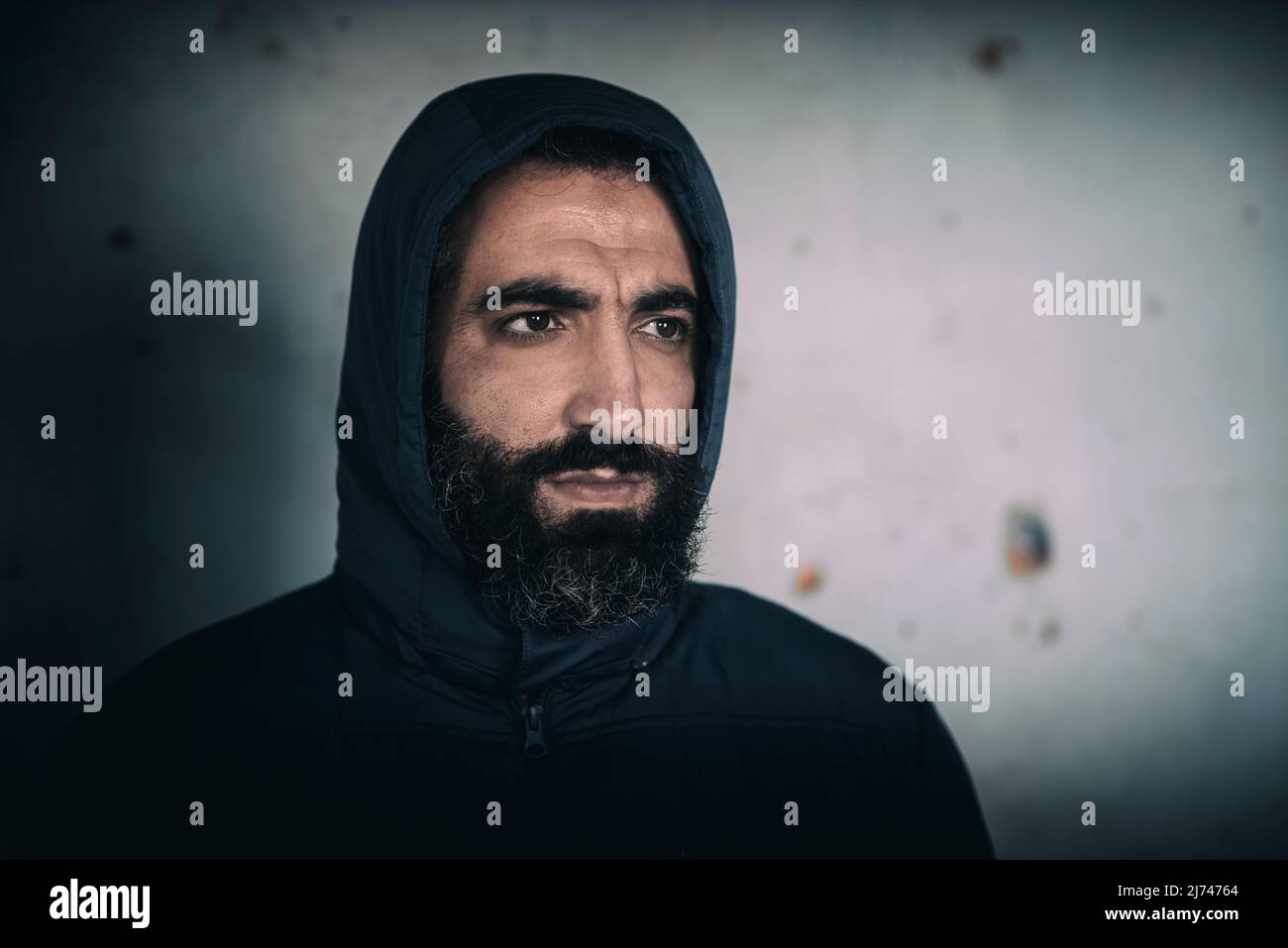 Bearded middle eastern man wearing hooded jacket Stock Photo - Alamy