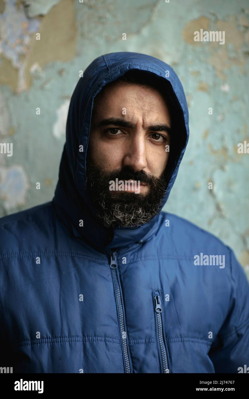 Bearded middle eastern man wearing hooded jacket Stock Photo - Alamy