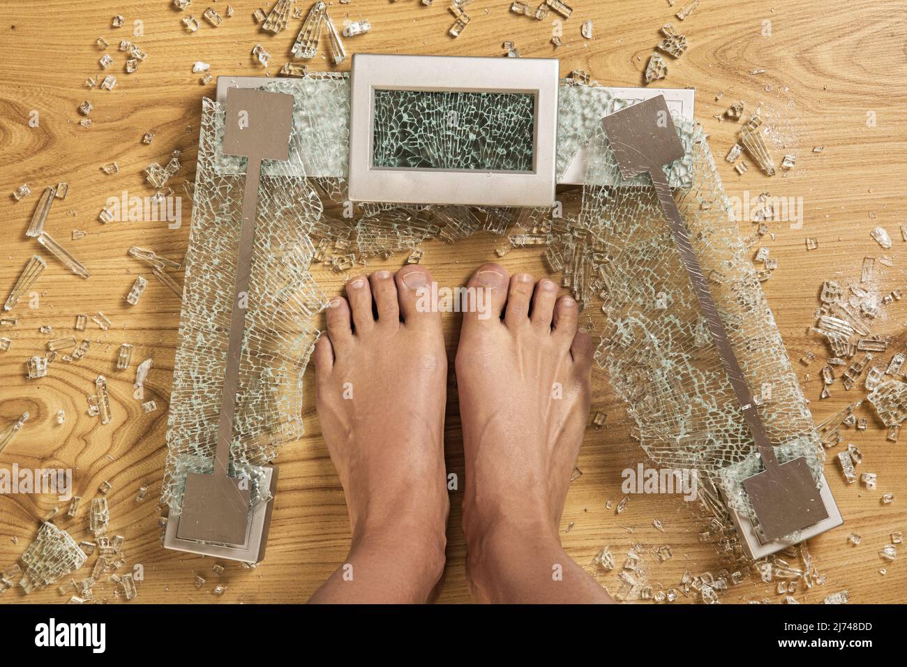 Overweight concept. Female feet and cracked glass weighing scale Stock ...