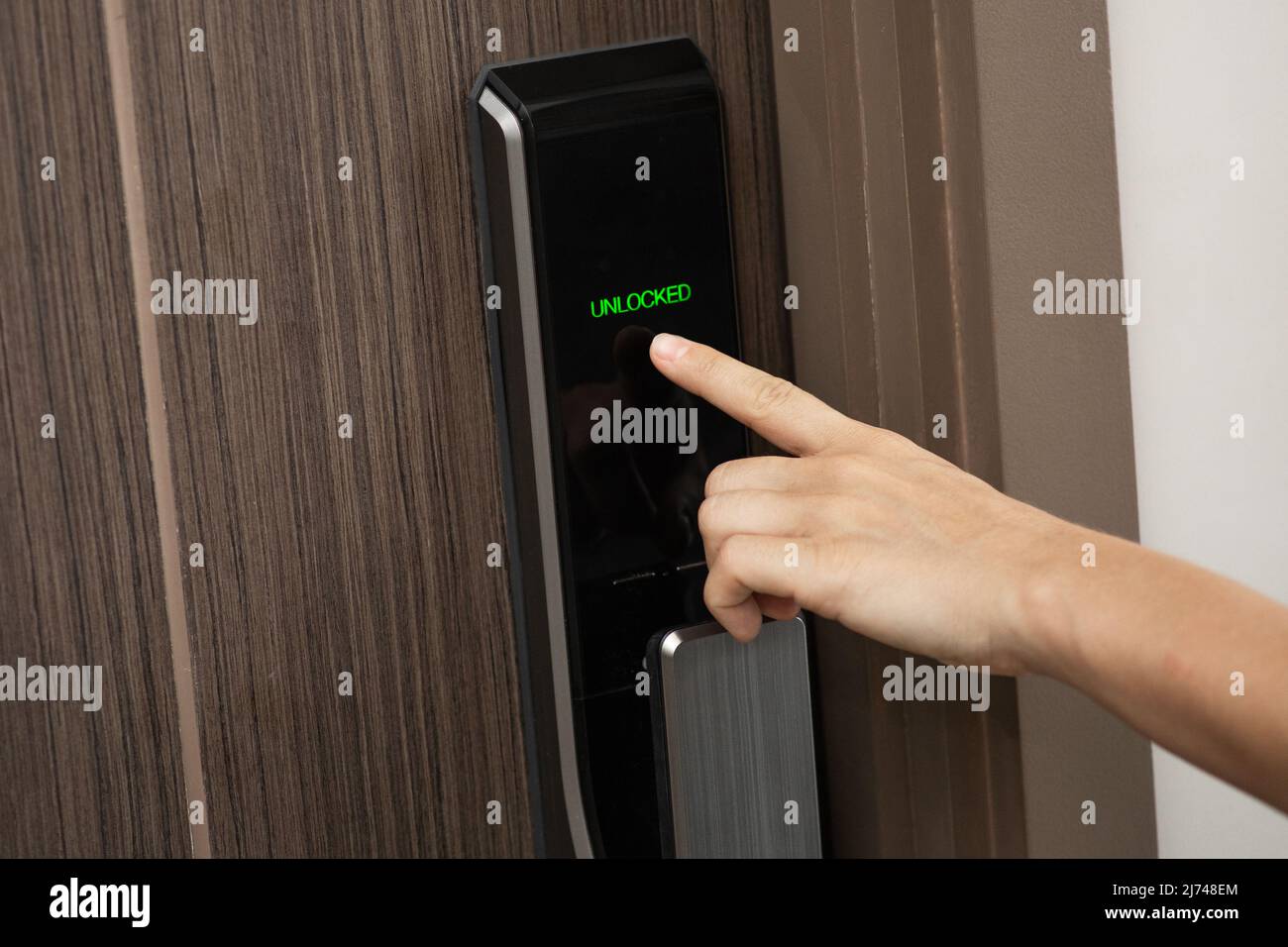 Hand and digital smart code lock into the modern apartment Stock Photo ...