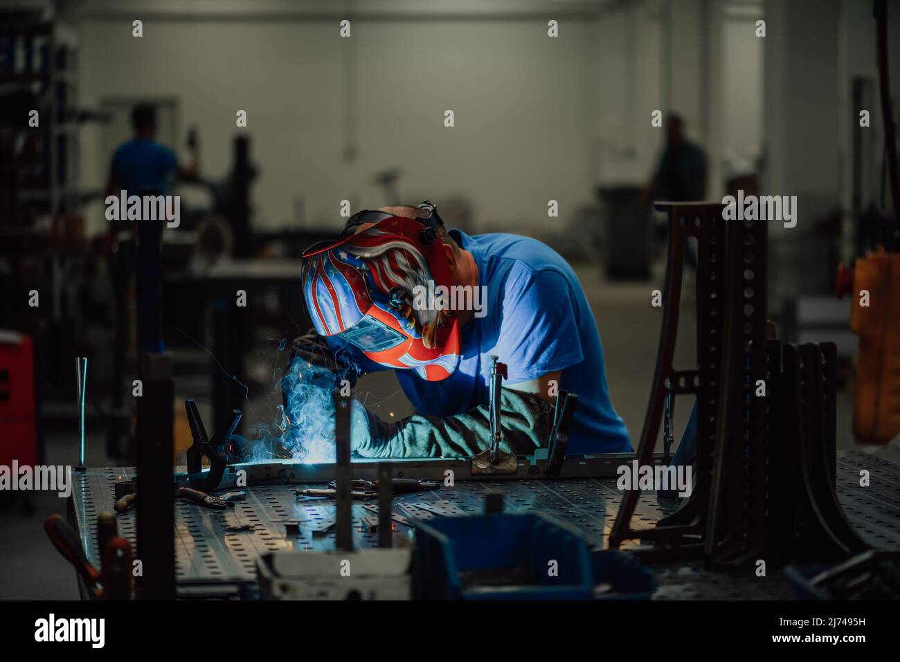 Professional Heavy Industry Welder Working Inside factory, Wears Helmet ...