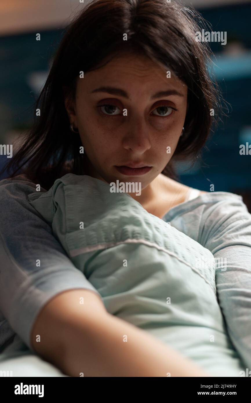 Portrait of anxious adult dealing with sadness and depression, hugging ...