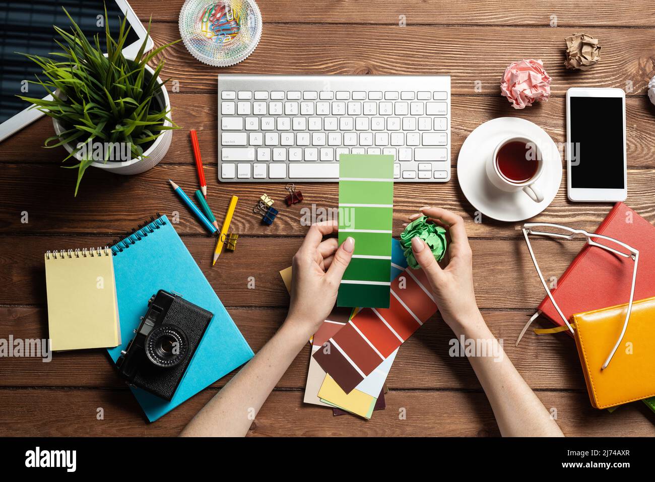 Web designer choosing colors from swatches Stock Photo - Alamy