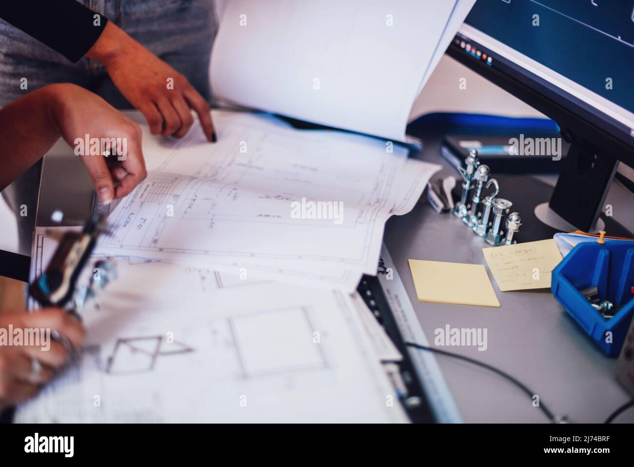 Engineer technician designing drawings mechanical parts engineering ...