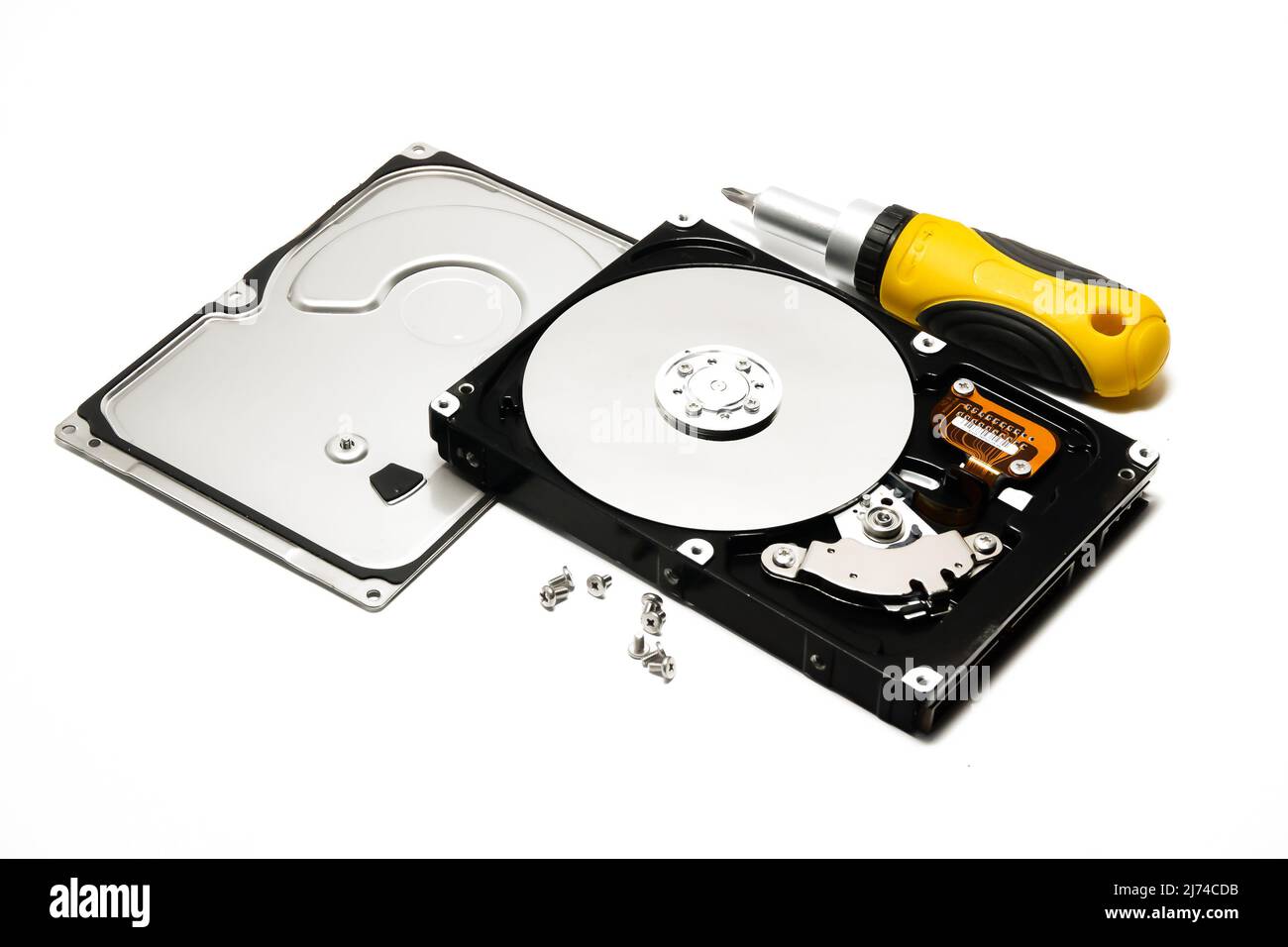 Open hard drive and screwdriver isolated on white background closeup ...