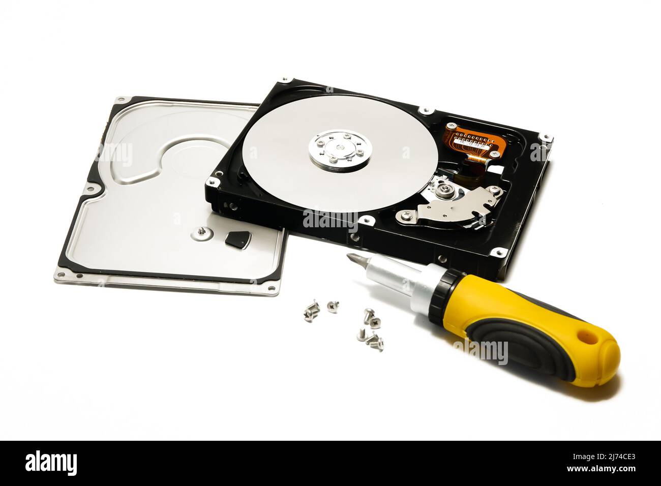Open hard drive and screwdriver isolated on white background closeup ...