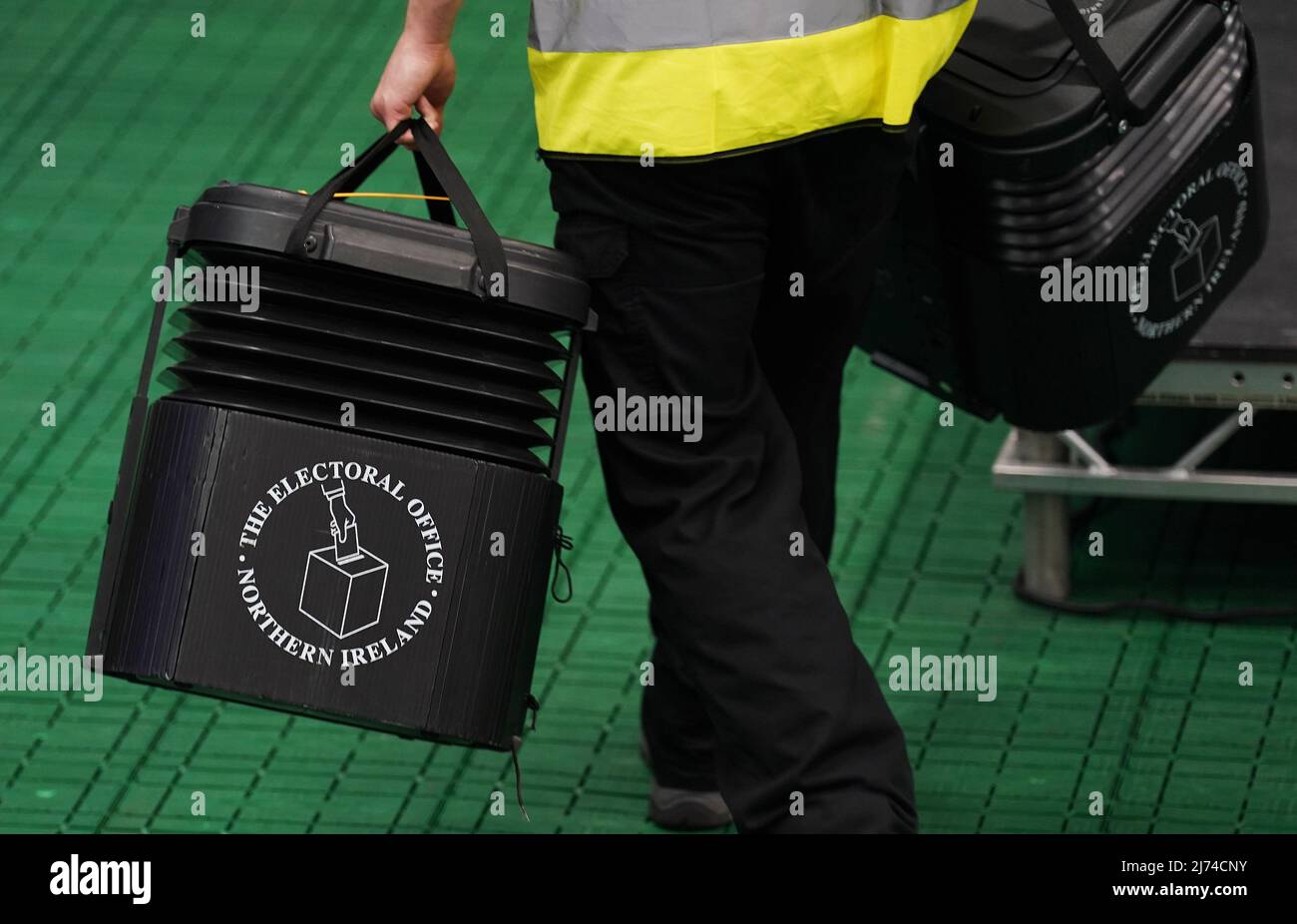 Ballot boxes are carried at Ulster University Jordanstown count centre ...