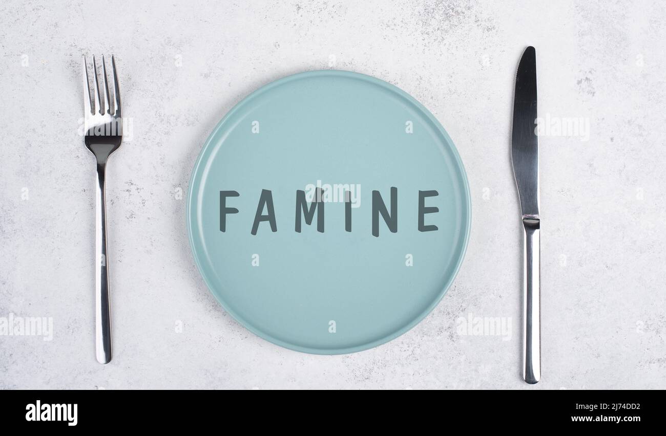 Famine is standing on the plate, food shortage and starving because of ...