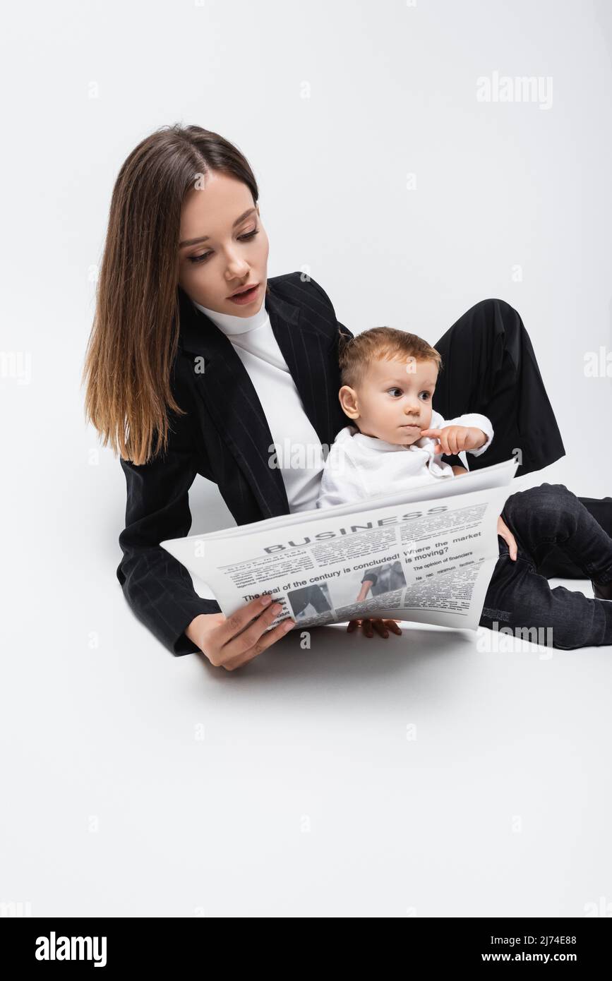 Child reading newspaper article hi-res stock photography and images - Alamy