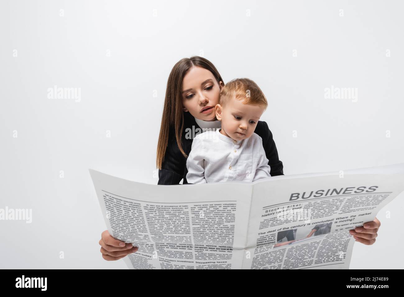 Child reading newspaper article hi-res stock photography and images - Alamy