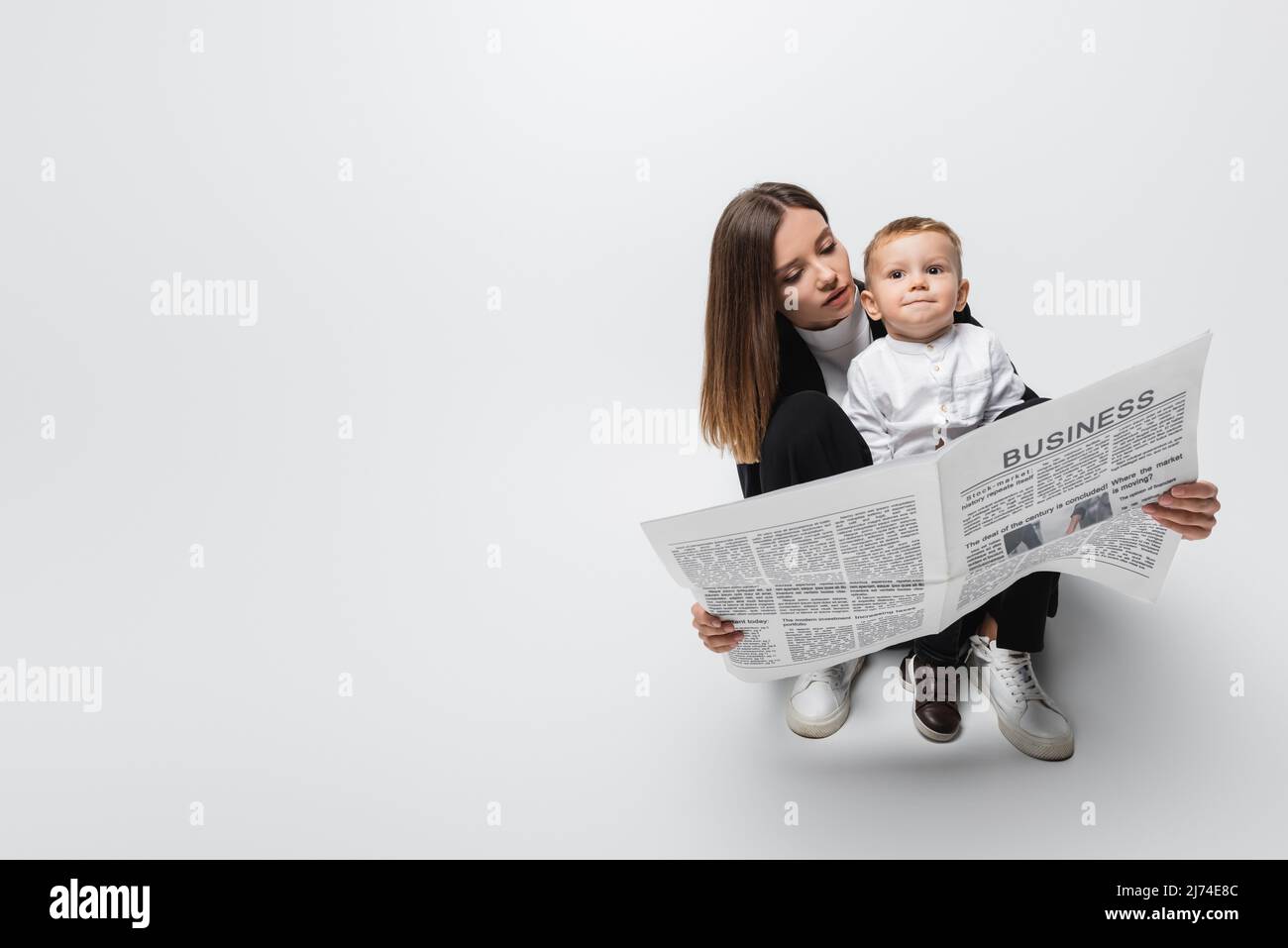 Child reading newspaper article hi-res stock photography and images - Alamy