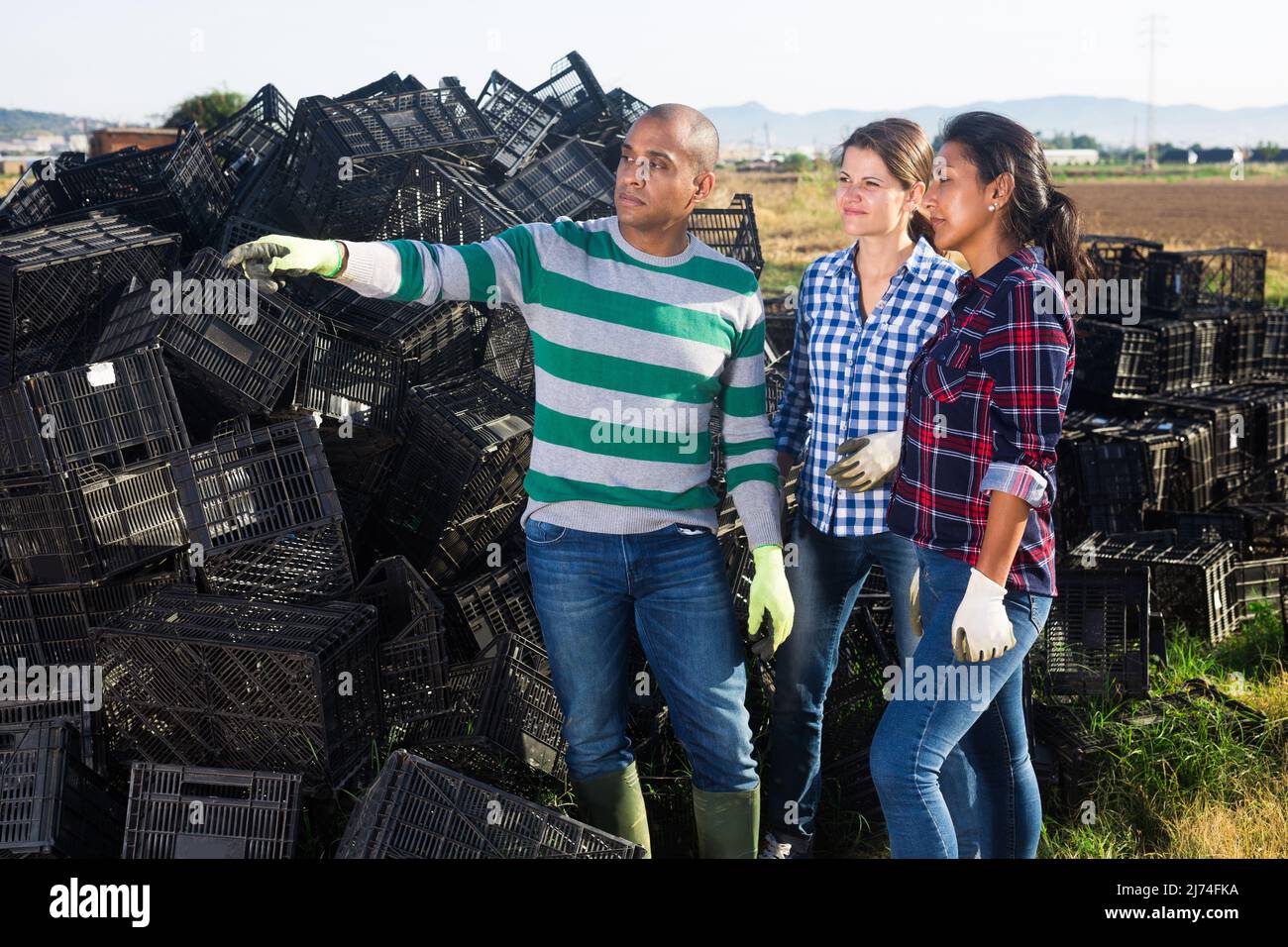 Agricultural cultivation three gardeners hi-res stock photography and ...
