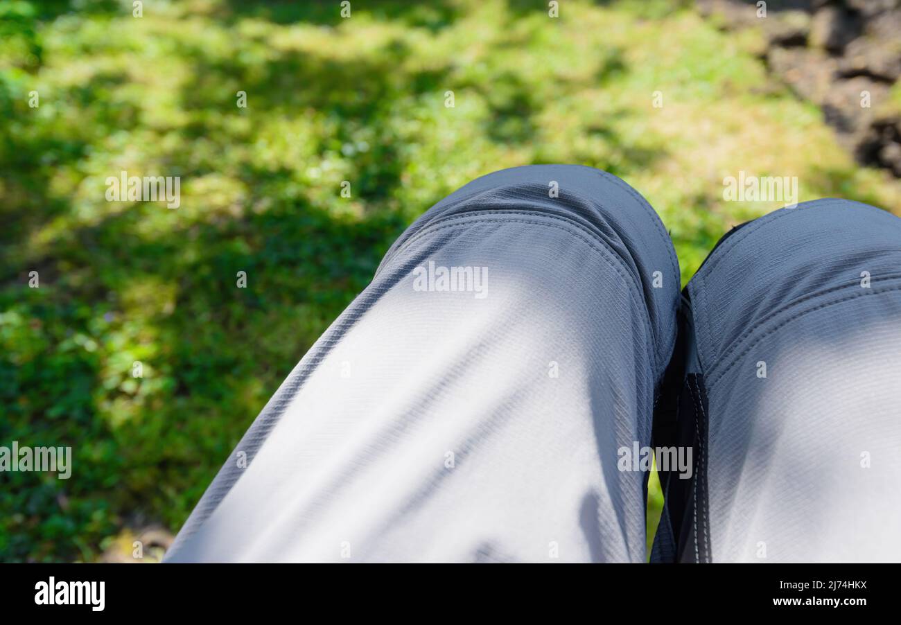 Hand resting on knee in hi-res stock photography and images - Alamy