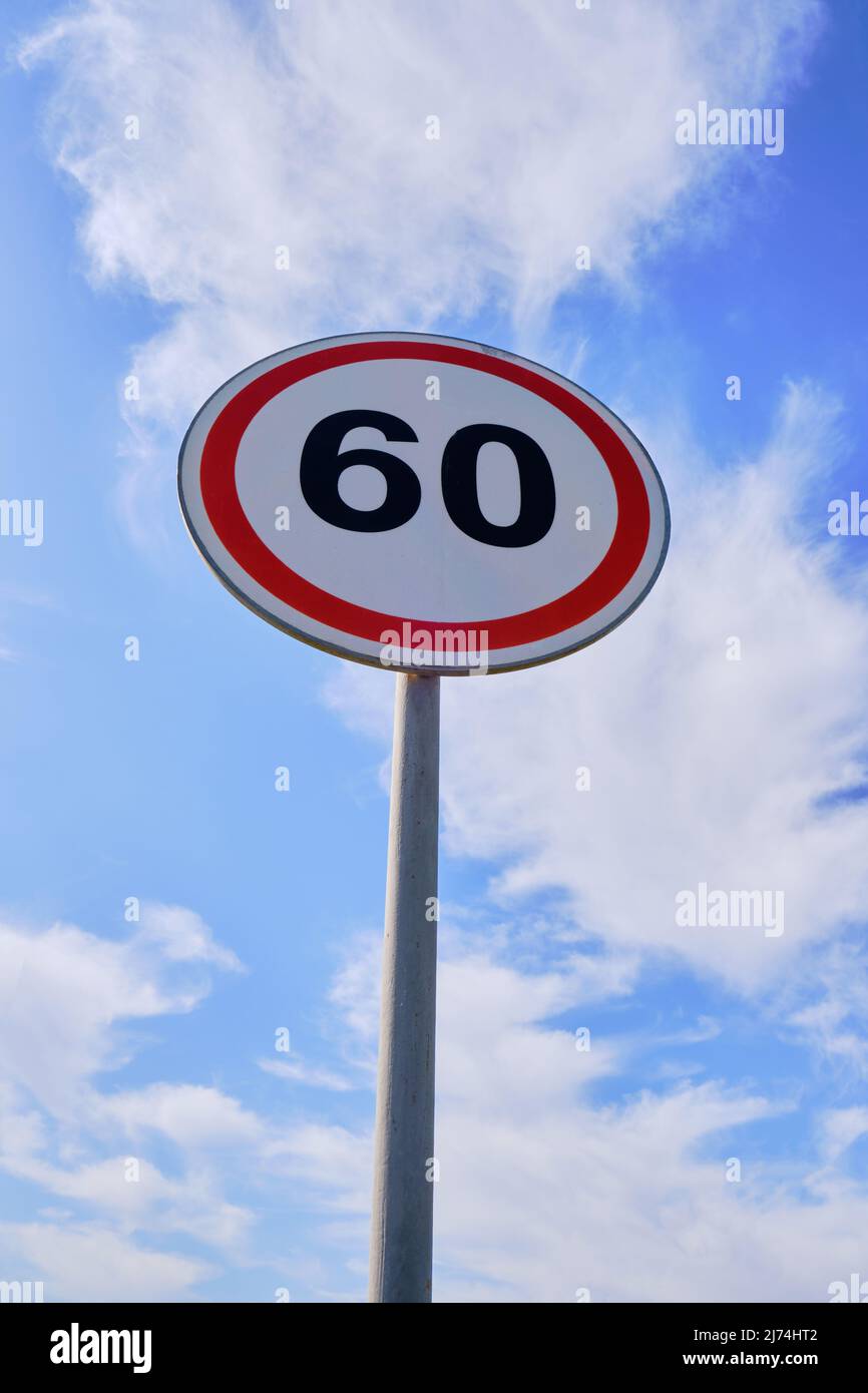 Road sign warning speed limit 60 kilometers per hour Stock Photo - Alamy