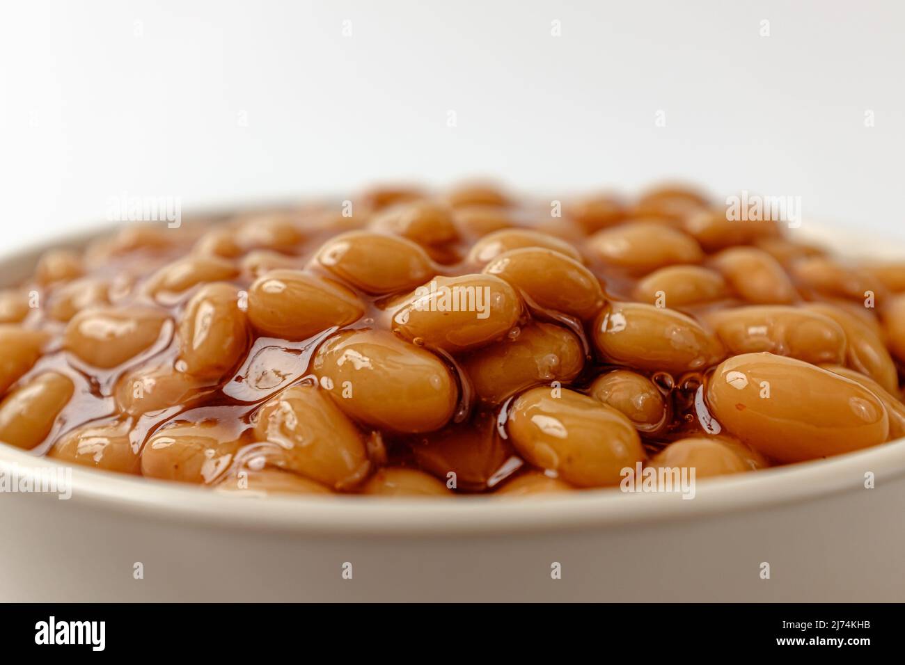baked beans on a white background Stock Photo - Alamy