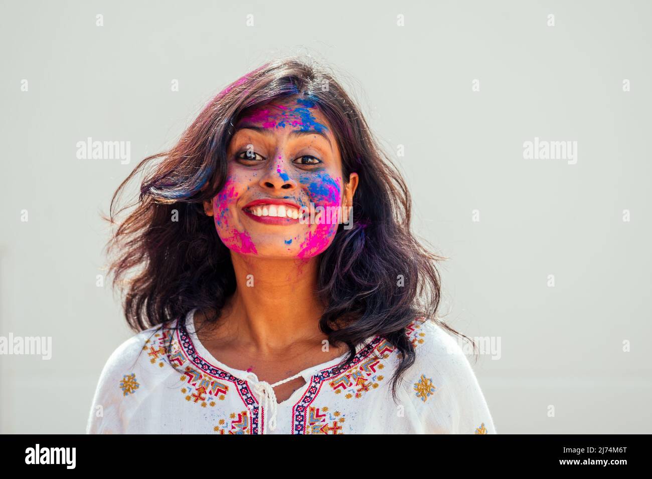 Holi Festival Of Colours. Portrait of happy indian girl in holi color ...