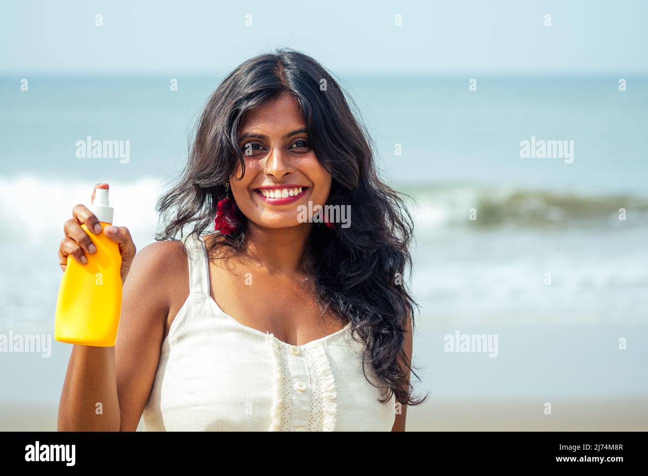 portrait of a beautiful and smiling snow-white smile indian woman black ...