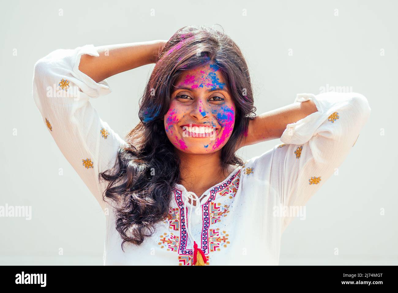 Holi Festival Of Colours. Portrait of happy indian girl in holi color ...