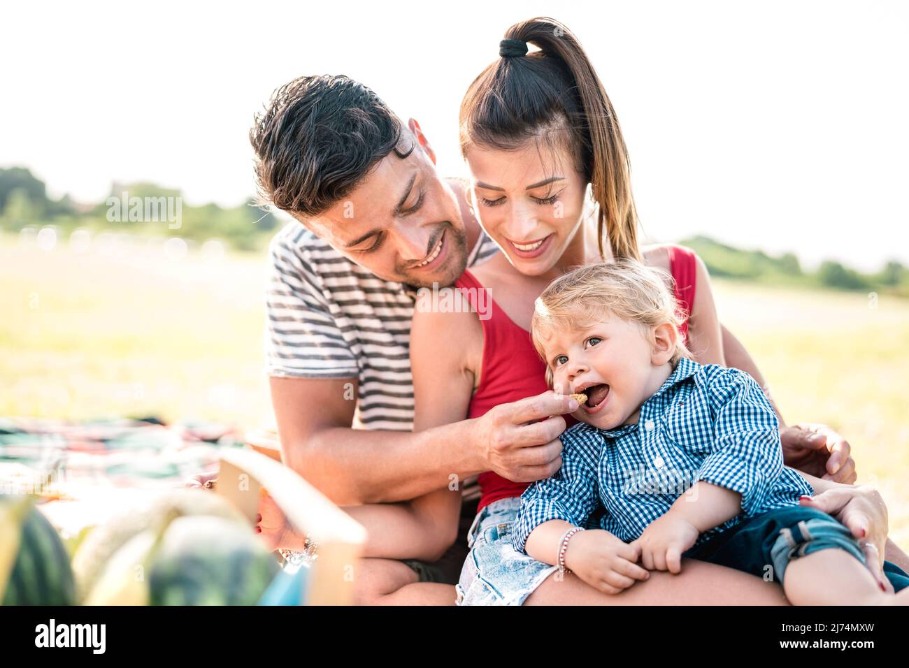 Happy family having fun together at picnic party - Joy and love concept ...