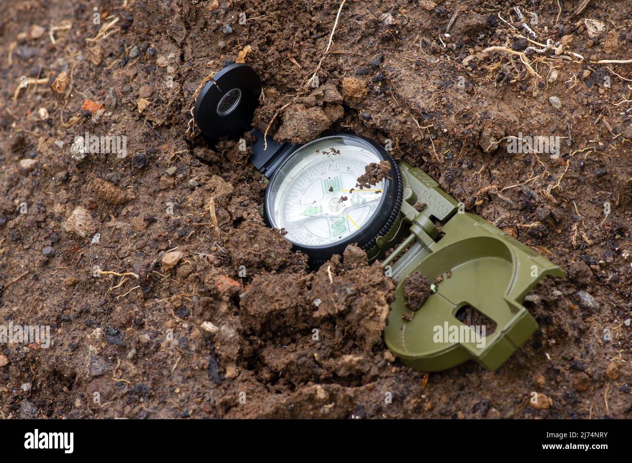 An green army magnetic compass on the ground Stock Photo - Alamy
