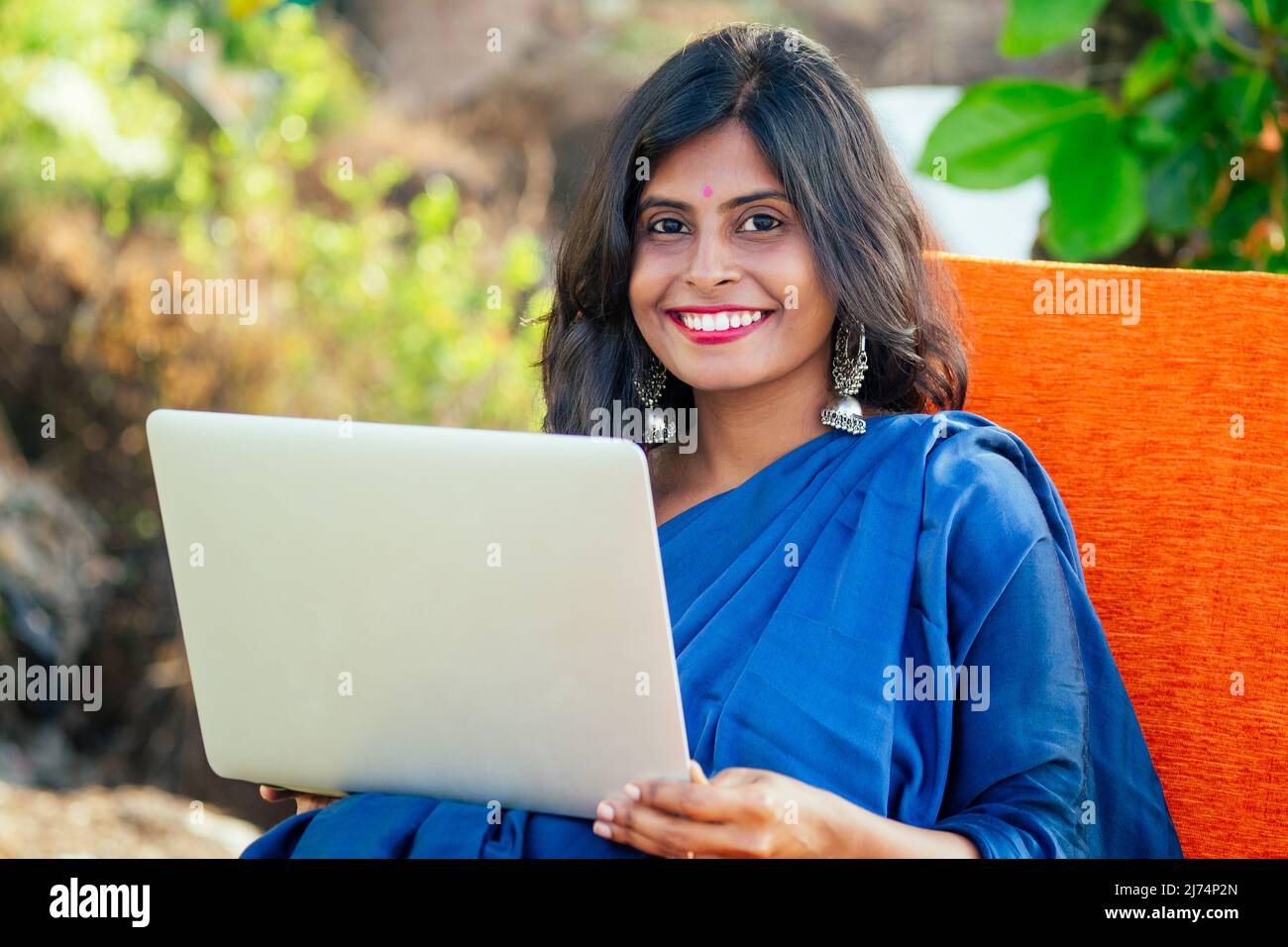 Indian girl using laptop in hi-res stock photography and images - Alamy