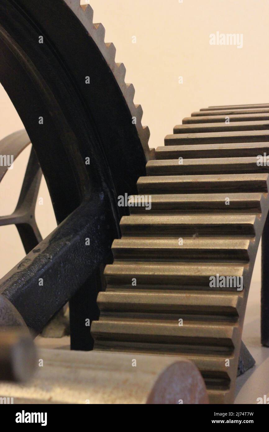 Vintage metal gears and cogs rotating together Stock Photo - Alamy