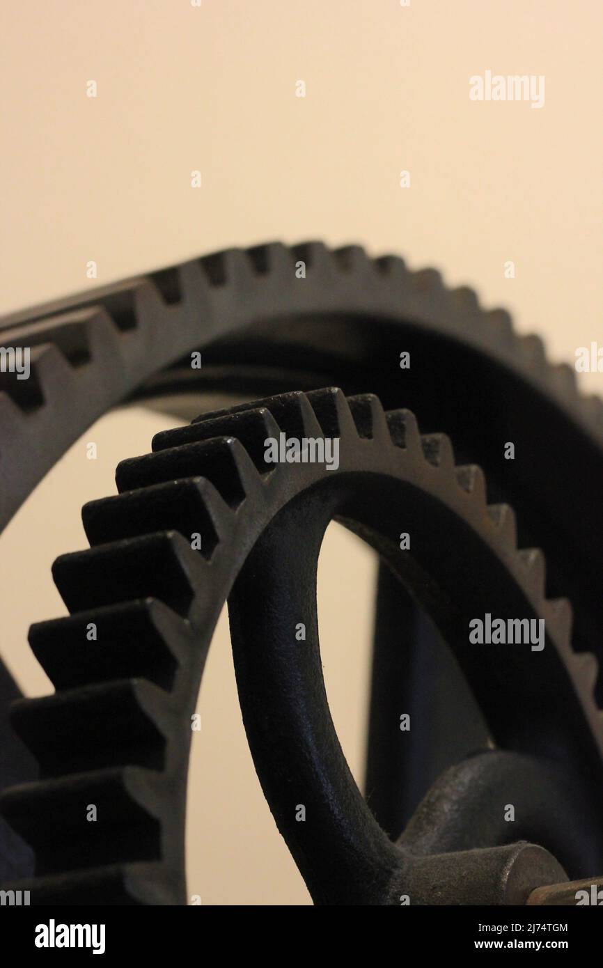 Vintage metal gears and cogs rotating together Stock Photo - Alamy