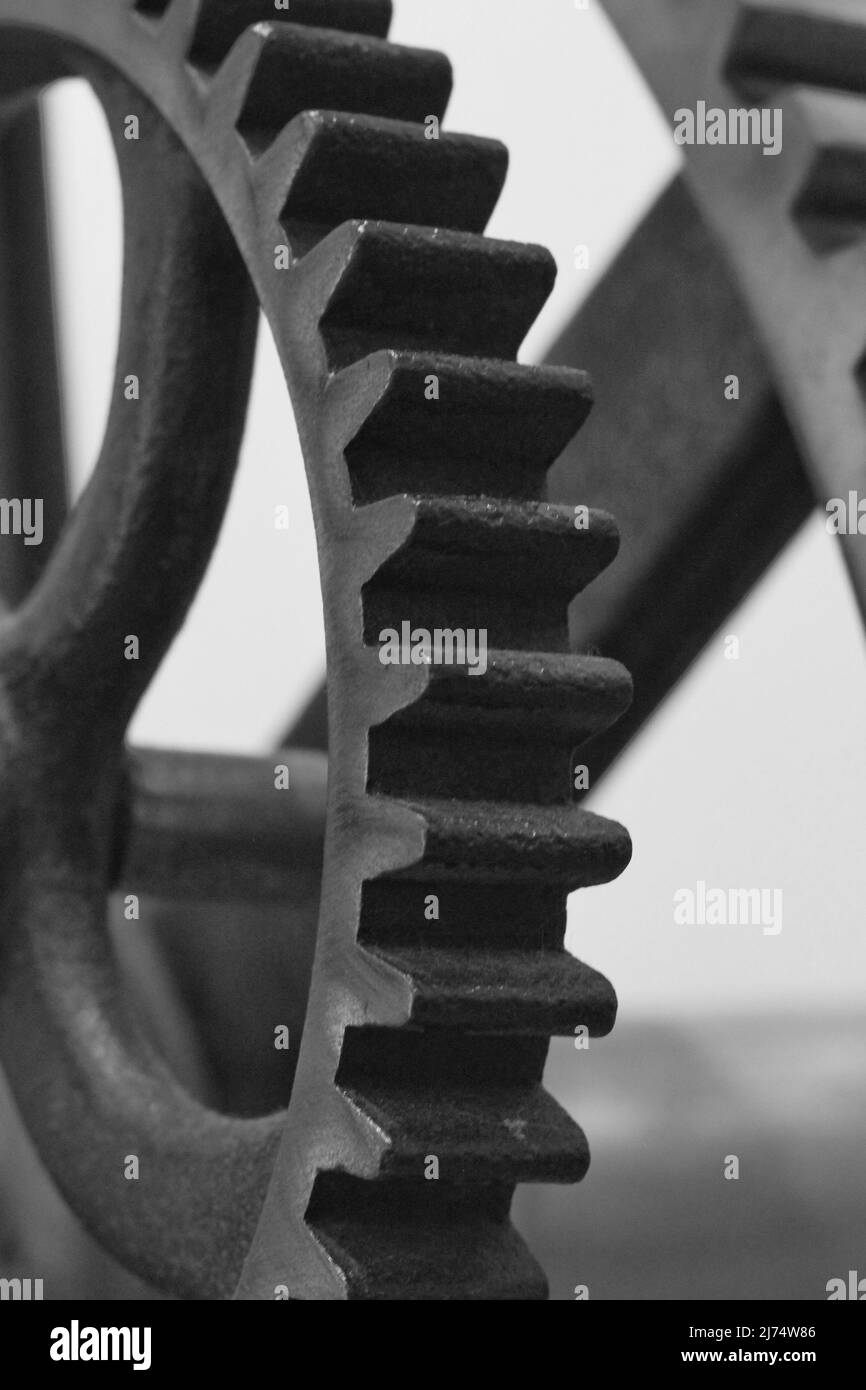 Vintage metal gears and cogs rotating together Stock Photo - Alamy