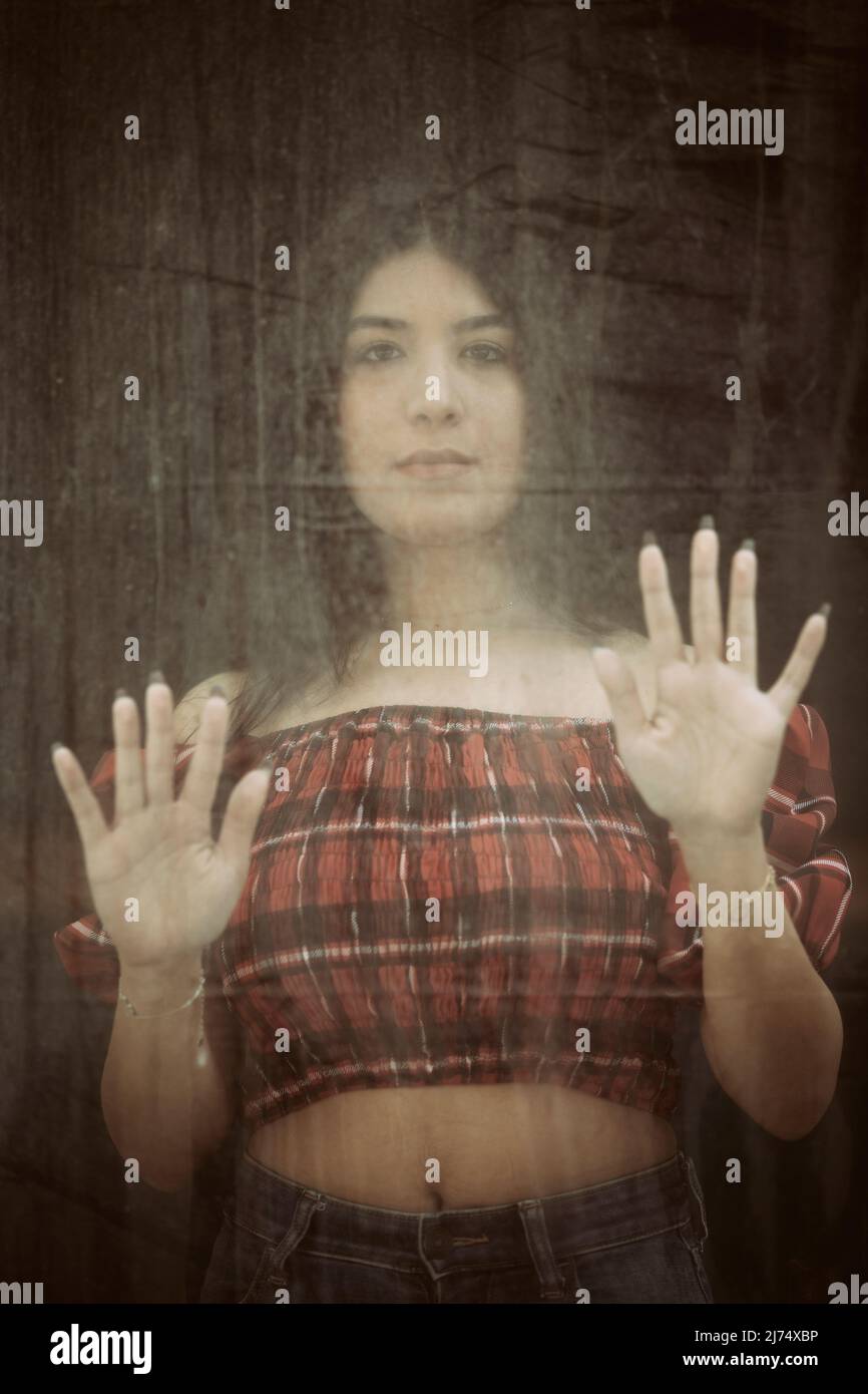 Woman standing behind dusty window Stock Photo - Alamy