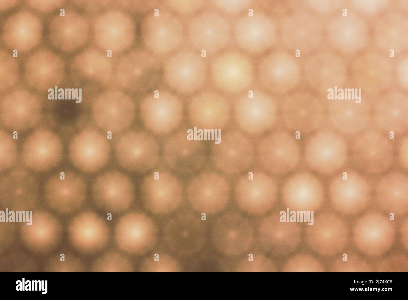 Repetitive circular pattern in a neutral orange Stock Photo - Alamy