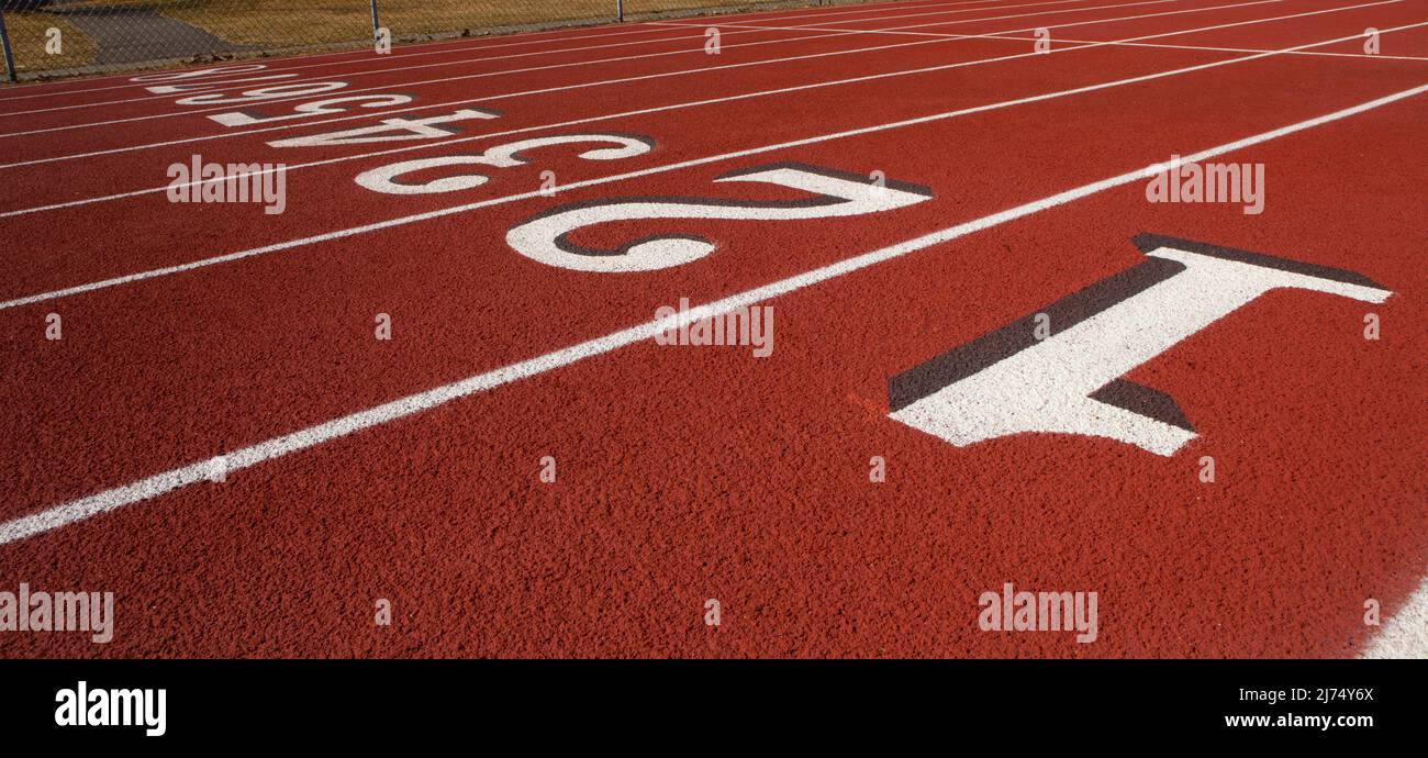 Close shot of a running / jogging track at the start / finish line ...
