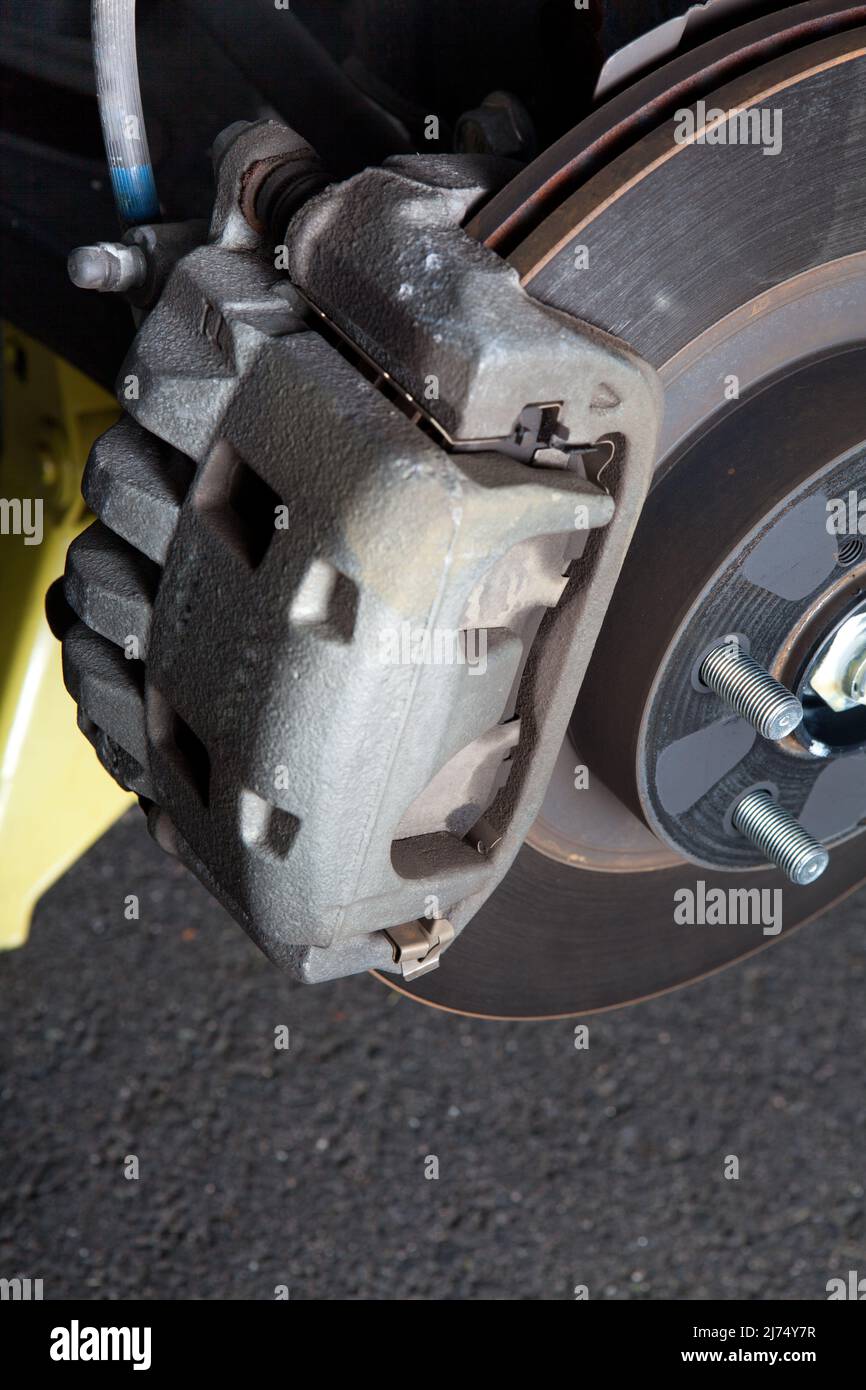 Brake disk and caliper assembly on a modern car about to be replaced ...