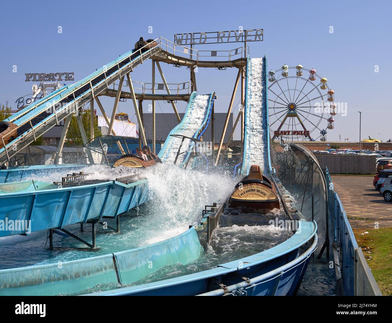 Splashing water on a log flume ride Stock Photo - Alamy