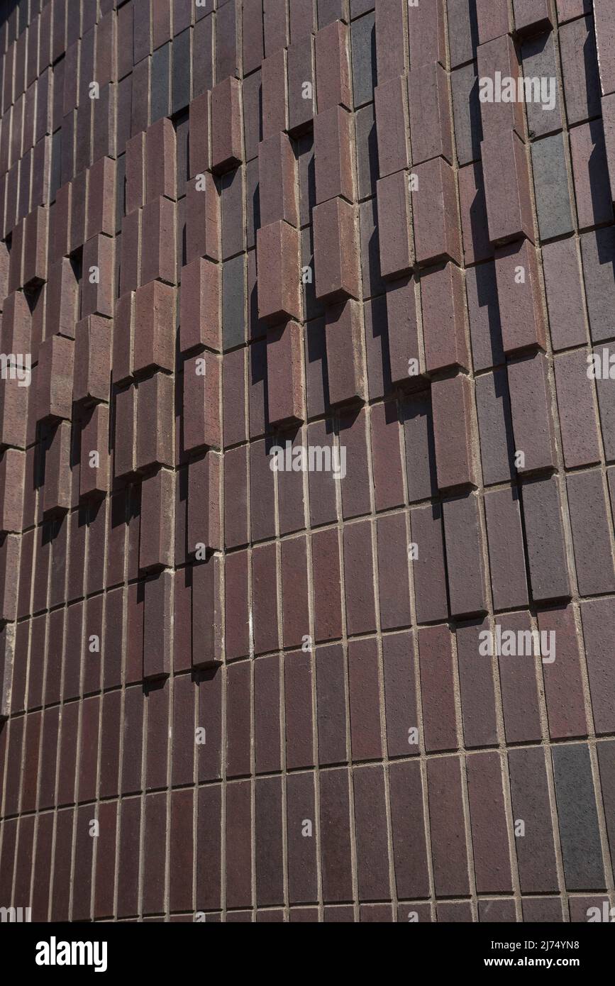 Brick / blockwork laid in stepped relief vertical lines as decoration ...