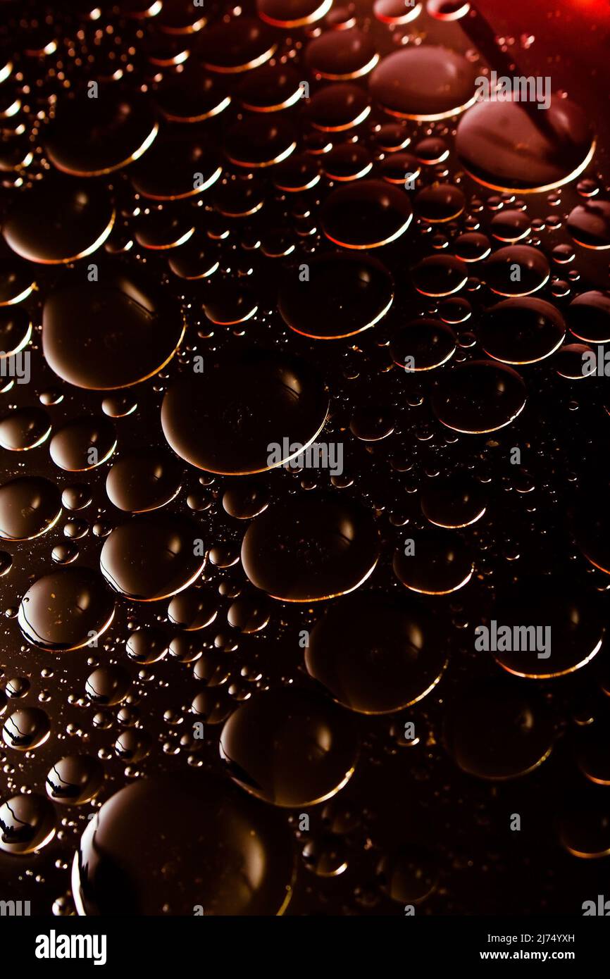 Abstract dark red shiny background with droplets. Droplets background ...