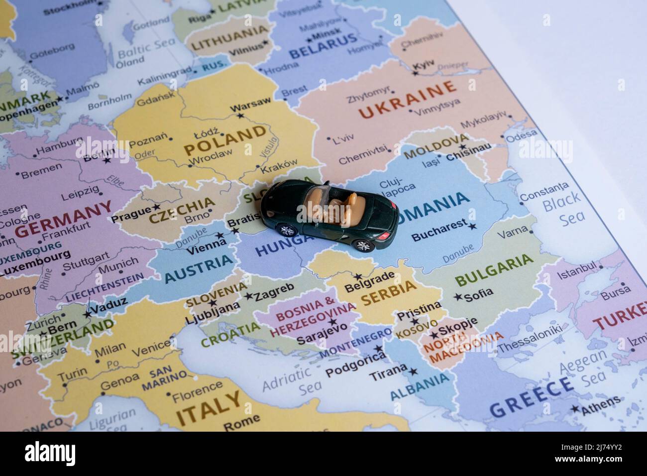 Toy car on Balkan Regions, side view, Balkans trip concept, miniature ...