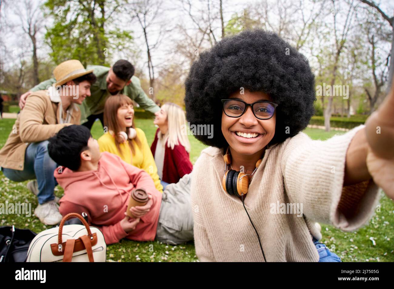 Young afro hair African American woman with group of cheerful friends ...