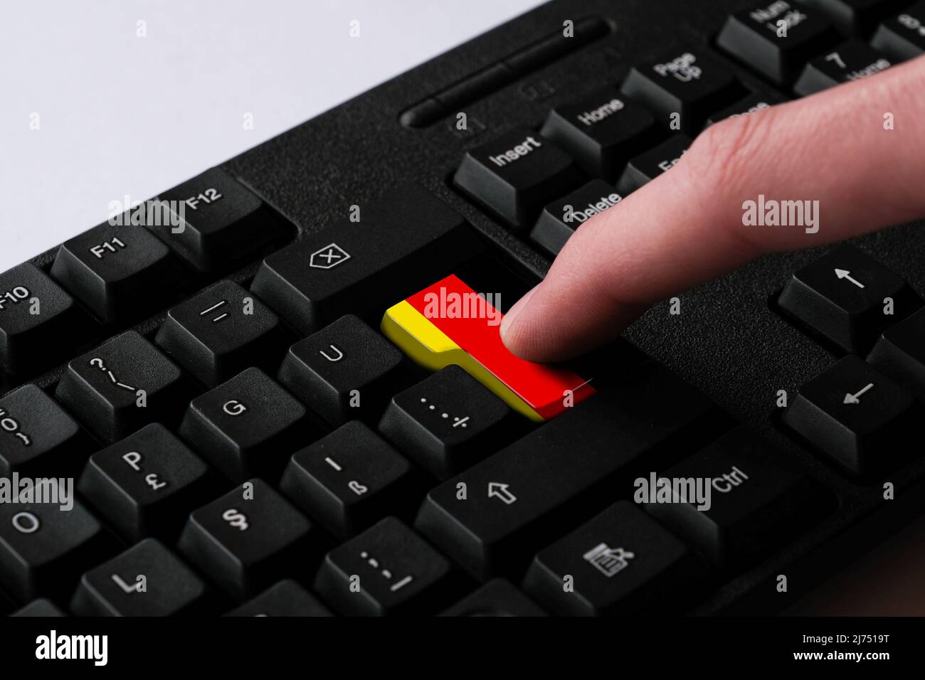 Pressing enter button with Germany flag, represents a cyber-attack of ...