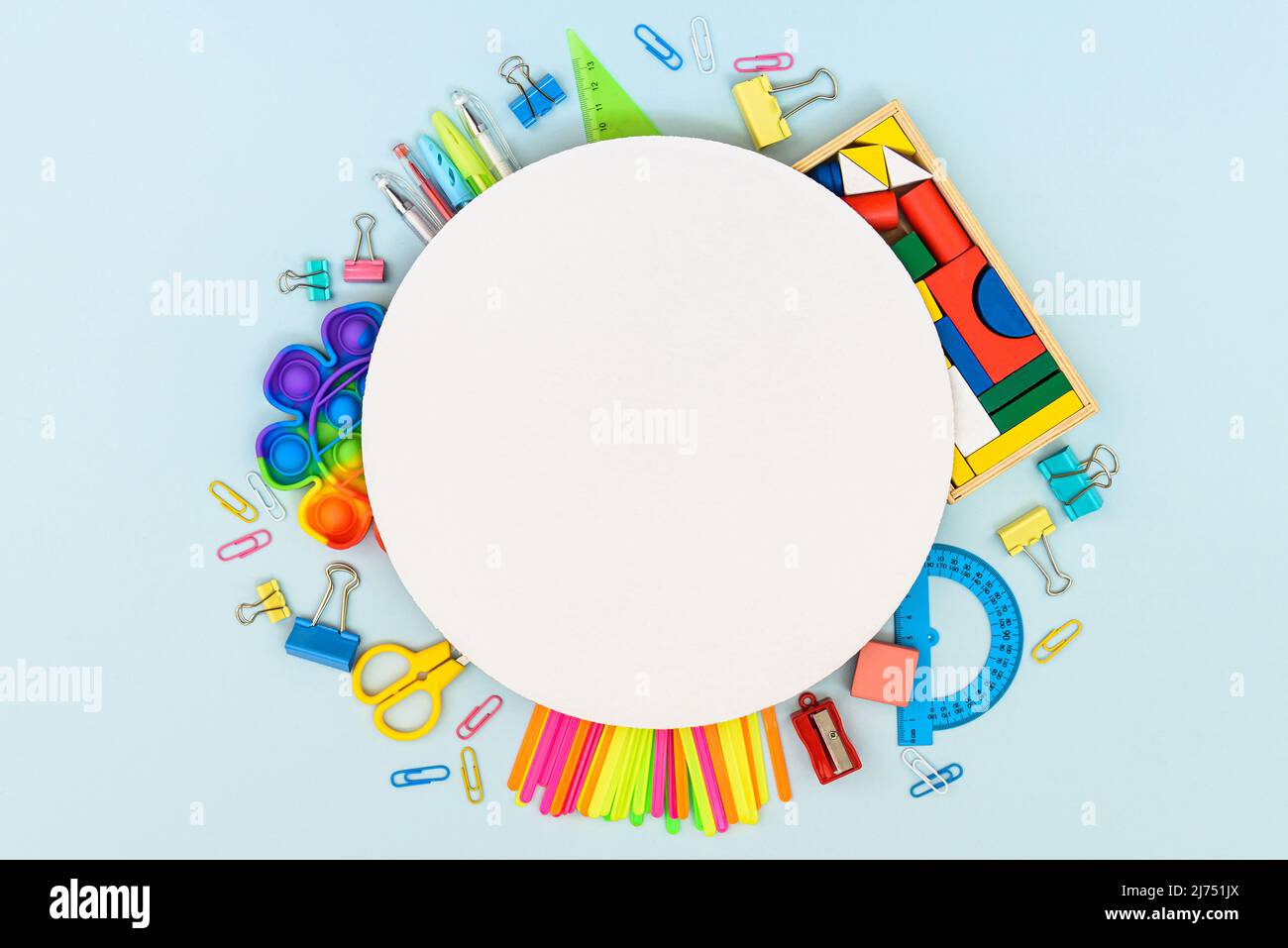 Round frame with stationery on the blue background, flatlay, copyspace ...