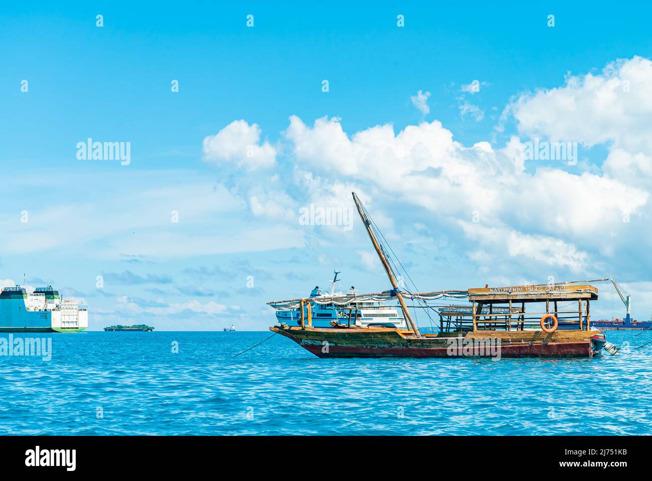 STONE TOWN, ZANZIBAR - DECEMBER 22, 2021: Boats in a port of Stone Town ...