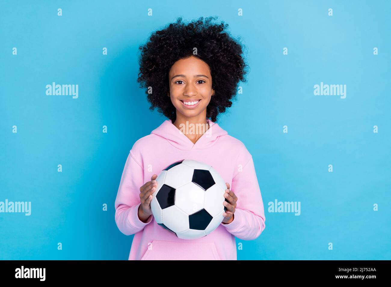 Photo of young pretty girl hold soccer ball player exercise sporty ...